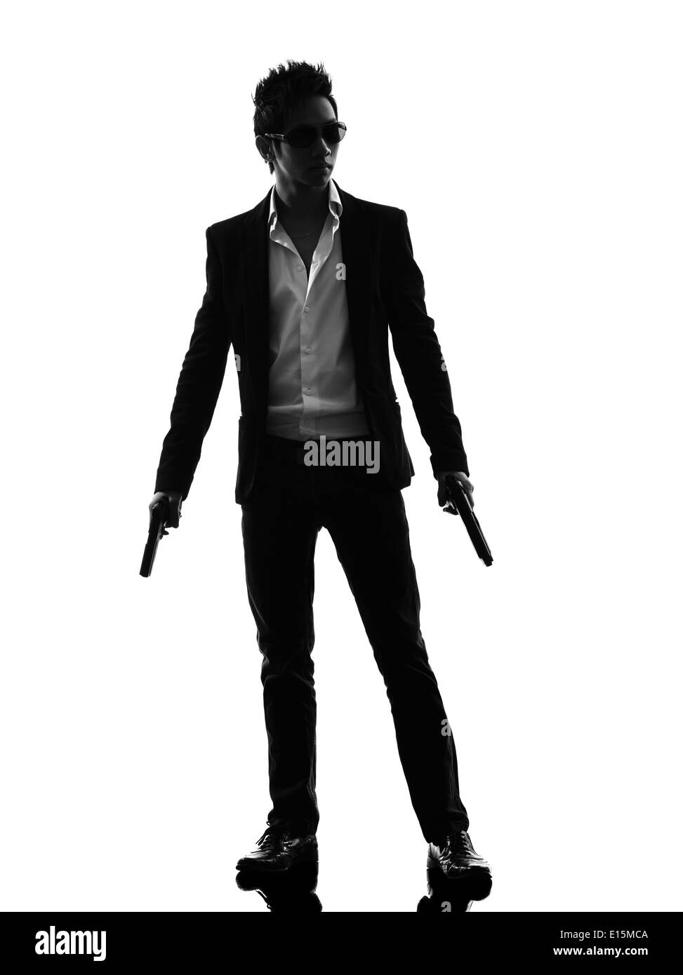 one asian gunman killer standing in silhouette isolated white ...