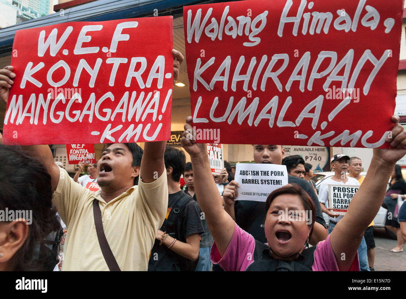 Manila, Philippines. 23rd May, 2014. Protesters holding placards saying ...