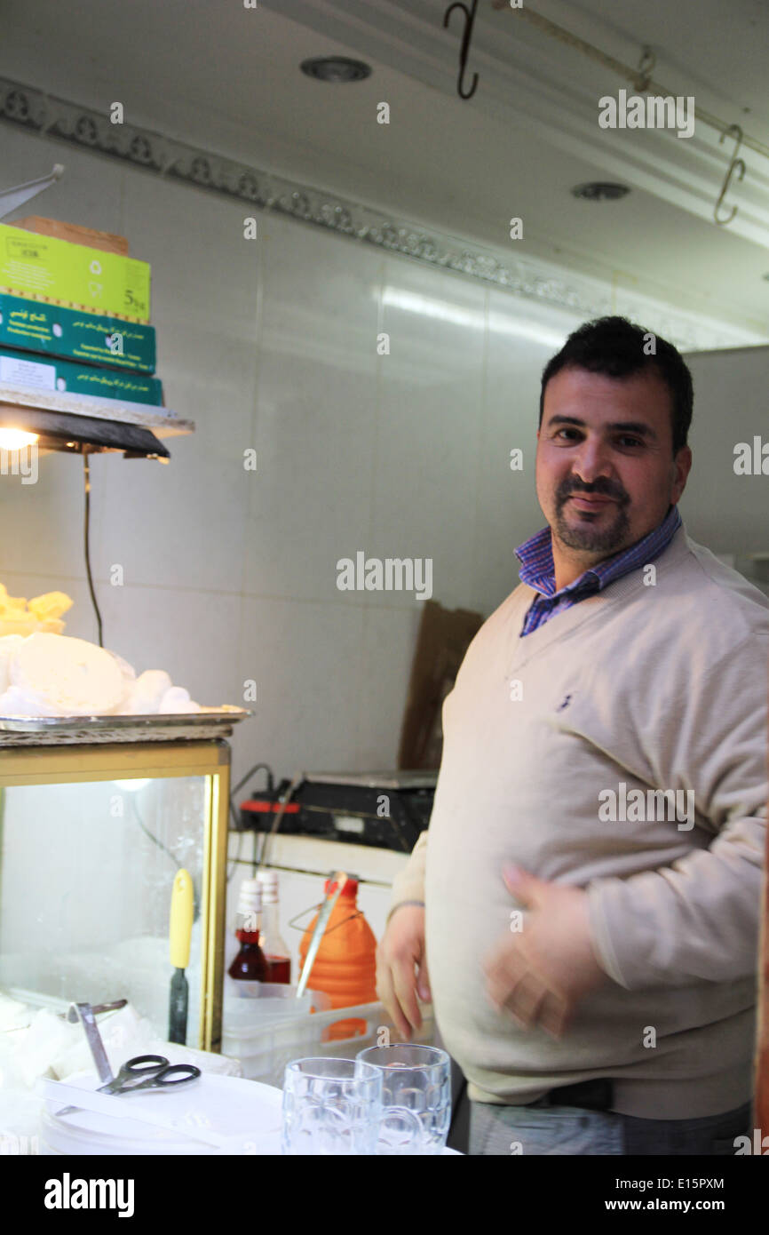 Moroccan male man selling food from a stall Stock Photo - Alamy