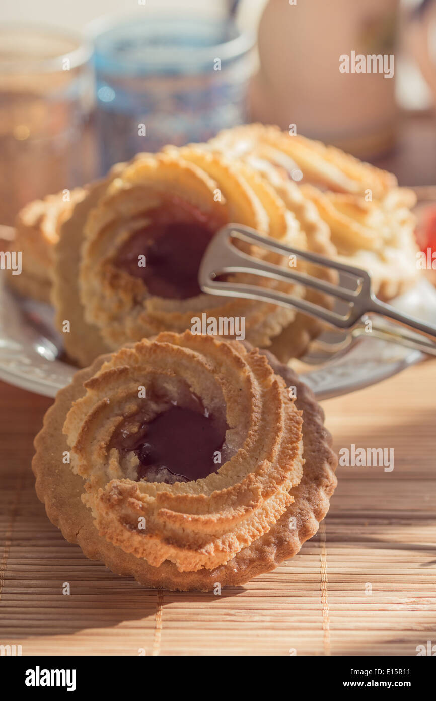 German Ox Eye cookies on a laid table Stock Photo - Alamy