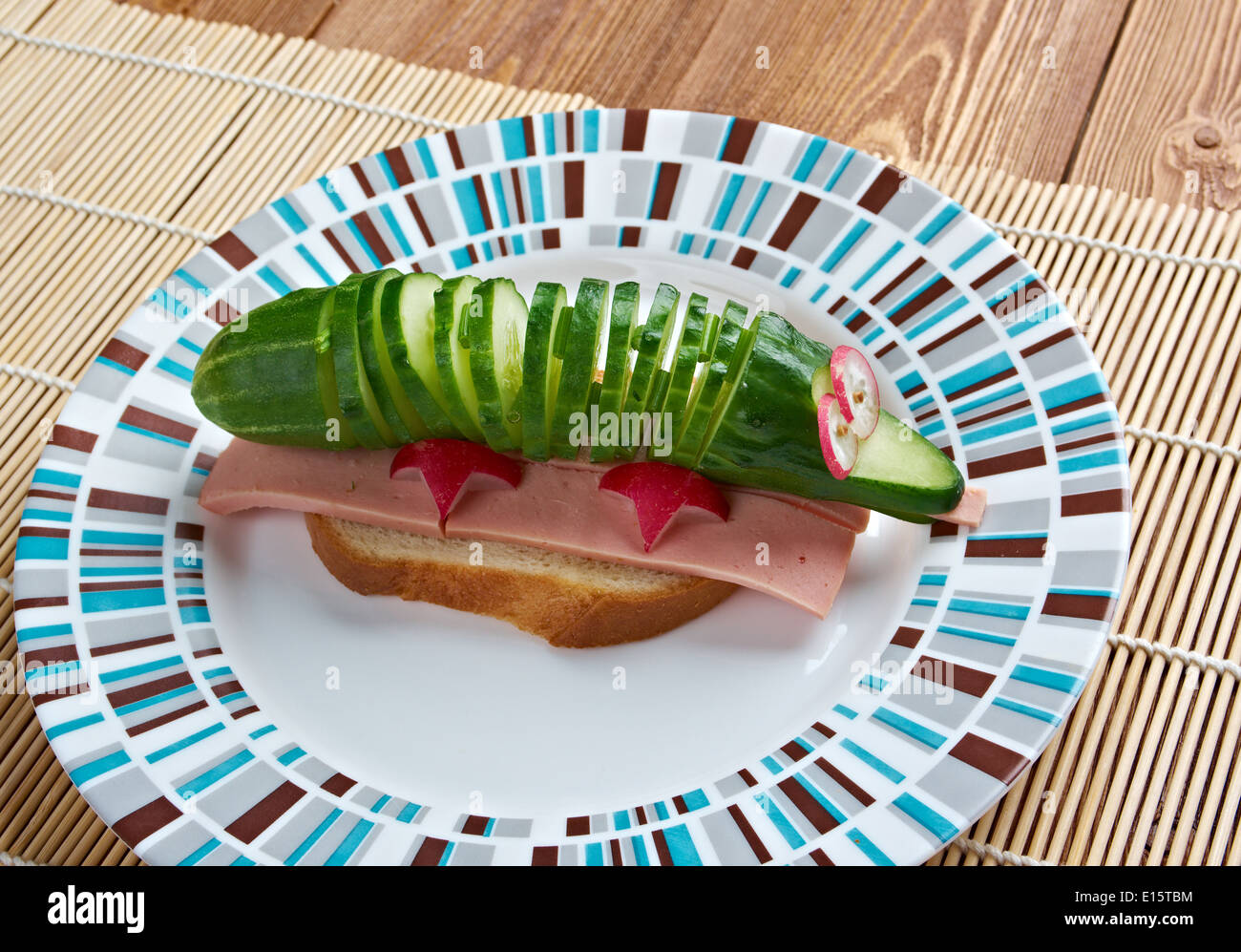 breakfast for child.crocodile sandwich sausage and cucumber Stock Photo ...