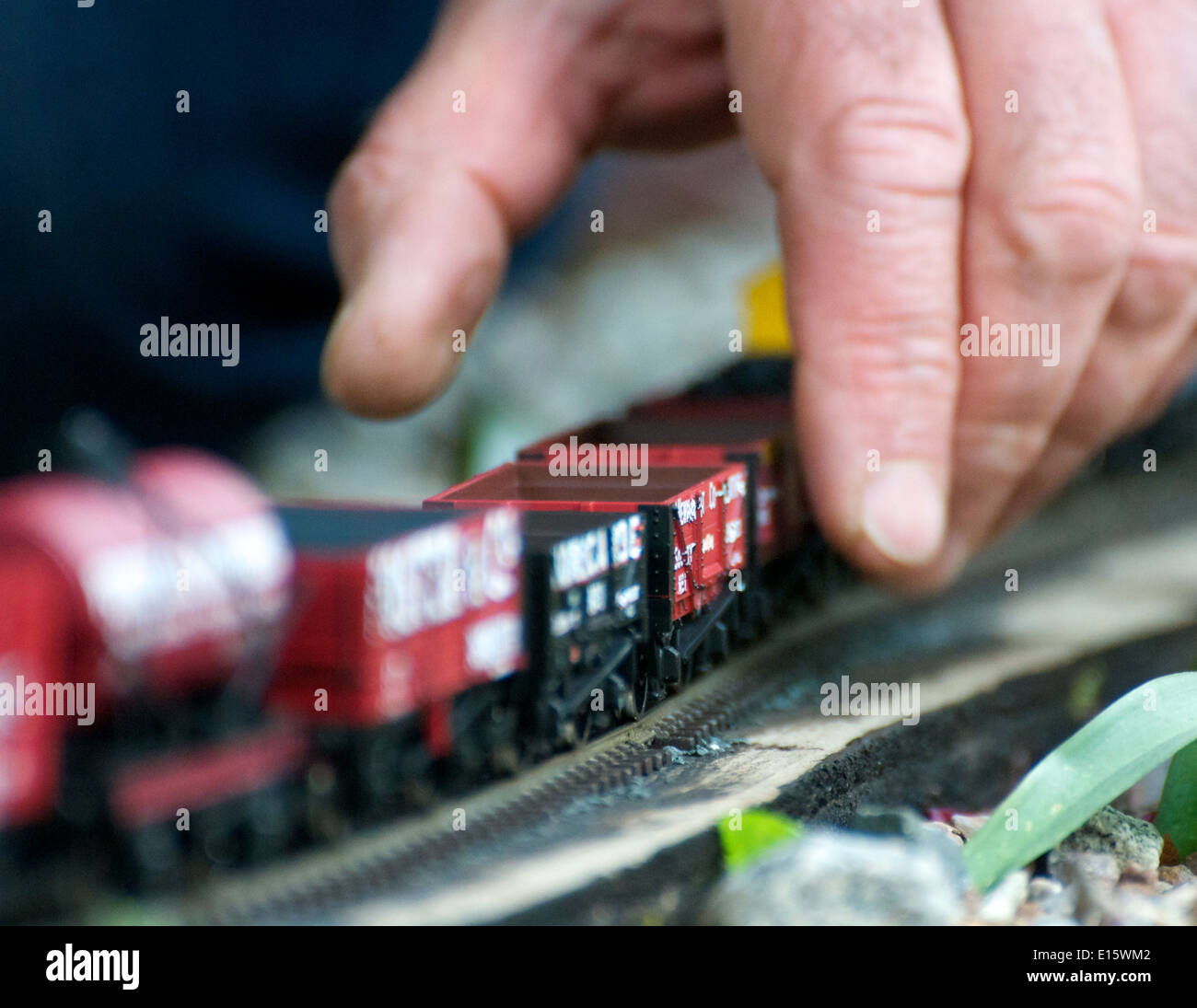 The Big Hand of The Controller manipulates a model freight railway ...