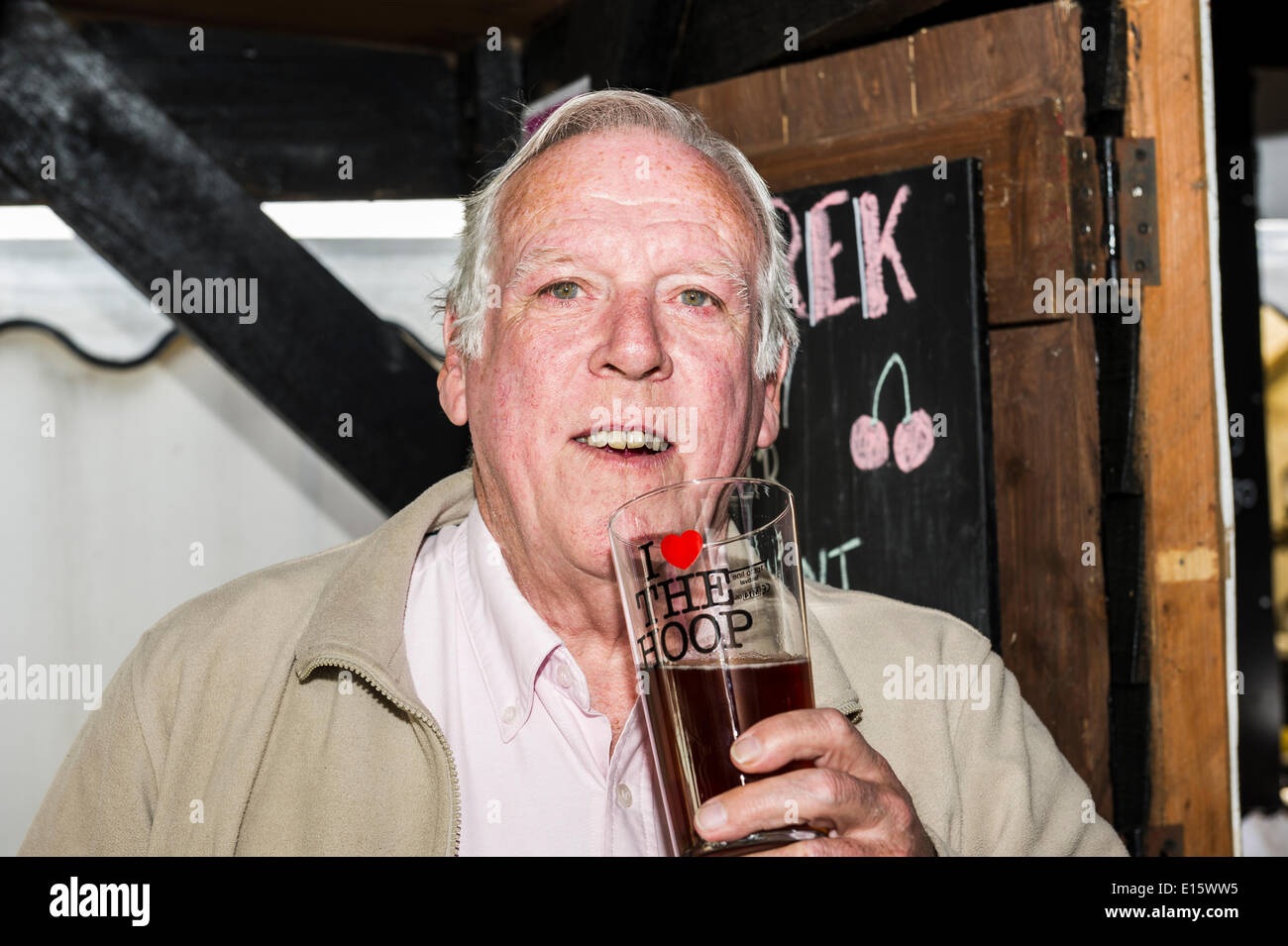 Stock, Essex. 23rd May, 2014. Robin Wolfenden enjoys his first pint of ...