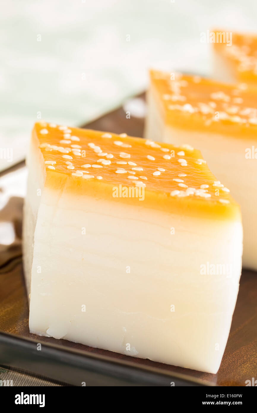 Layered Chinese rice cakes with sesame seed topping Stock Photo - Alamy