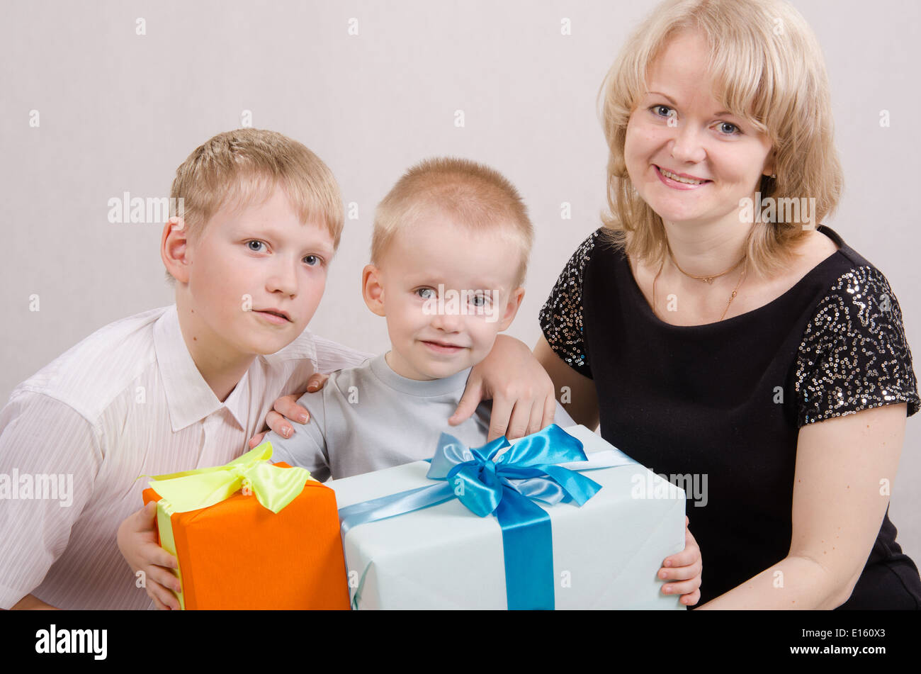 Five children give gifts mother and brother Stock Photo - Alamy