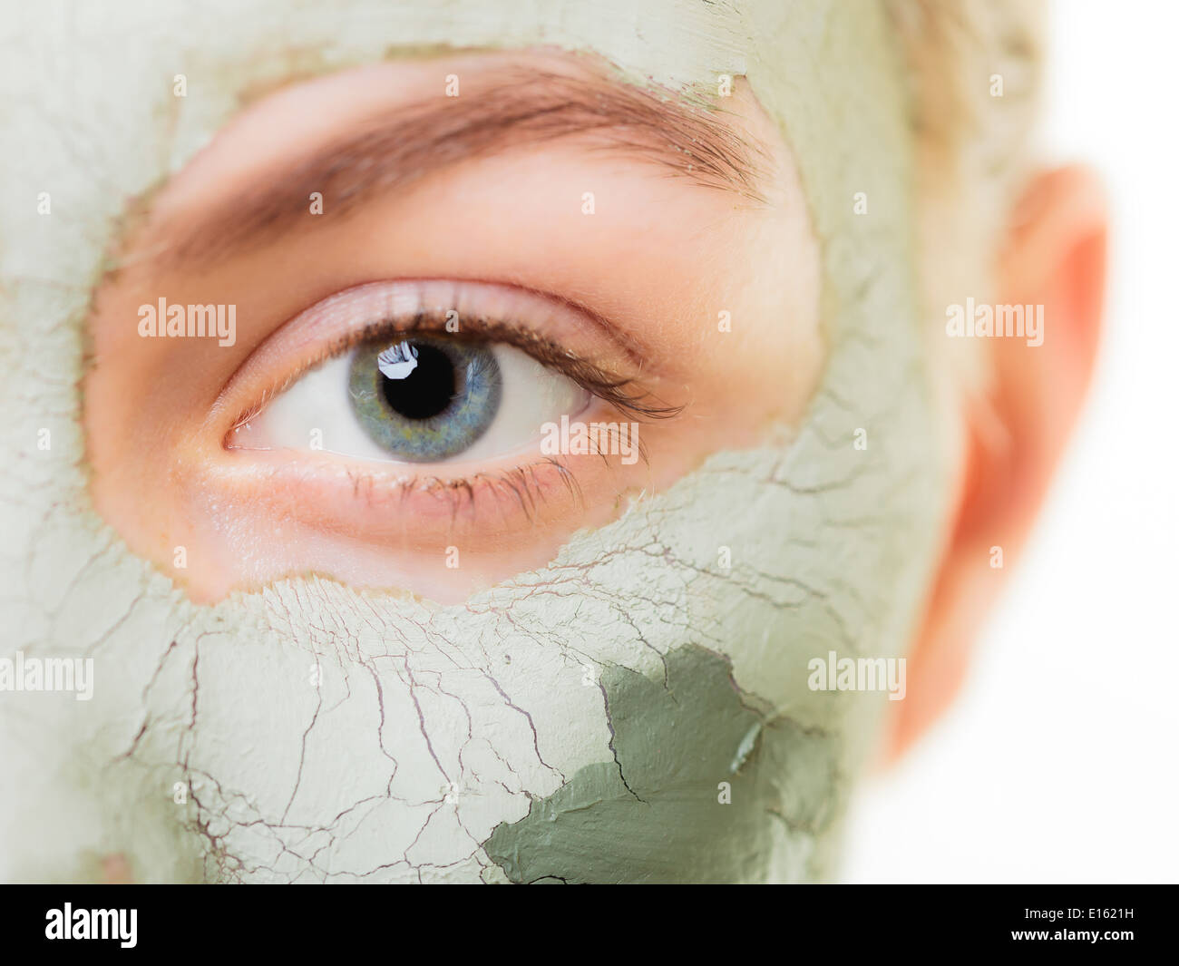 Skin care. Woman applying clay mask on face. Spa Stock Photo - Alamy