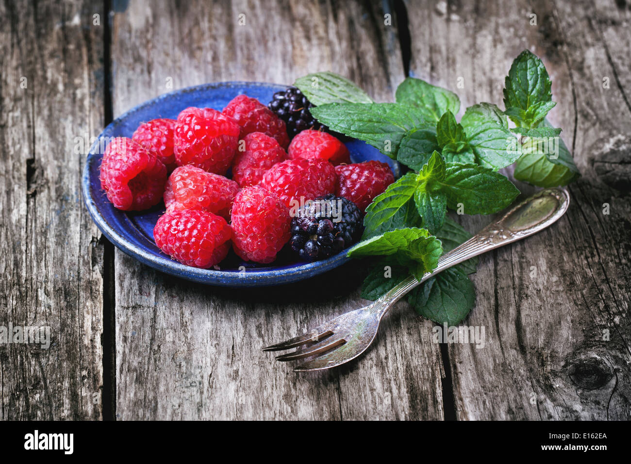 Over vintage wood table with fresh berries hi-res stock photography and ...