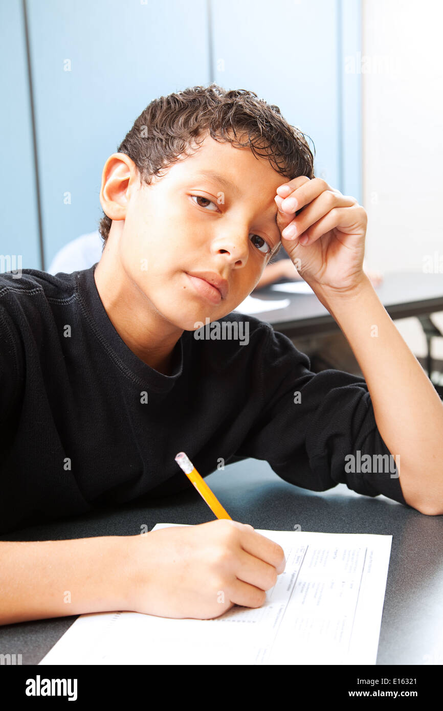 Teen boy worried about taking a standardized test Stock Photo - Alamy