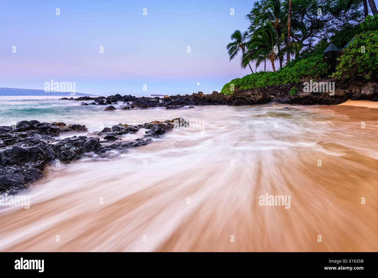 Sunrise with the Moon over beautiful and secluded Secret Beach in Maui ...