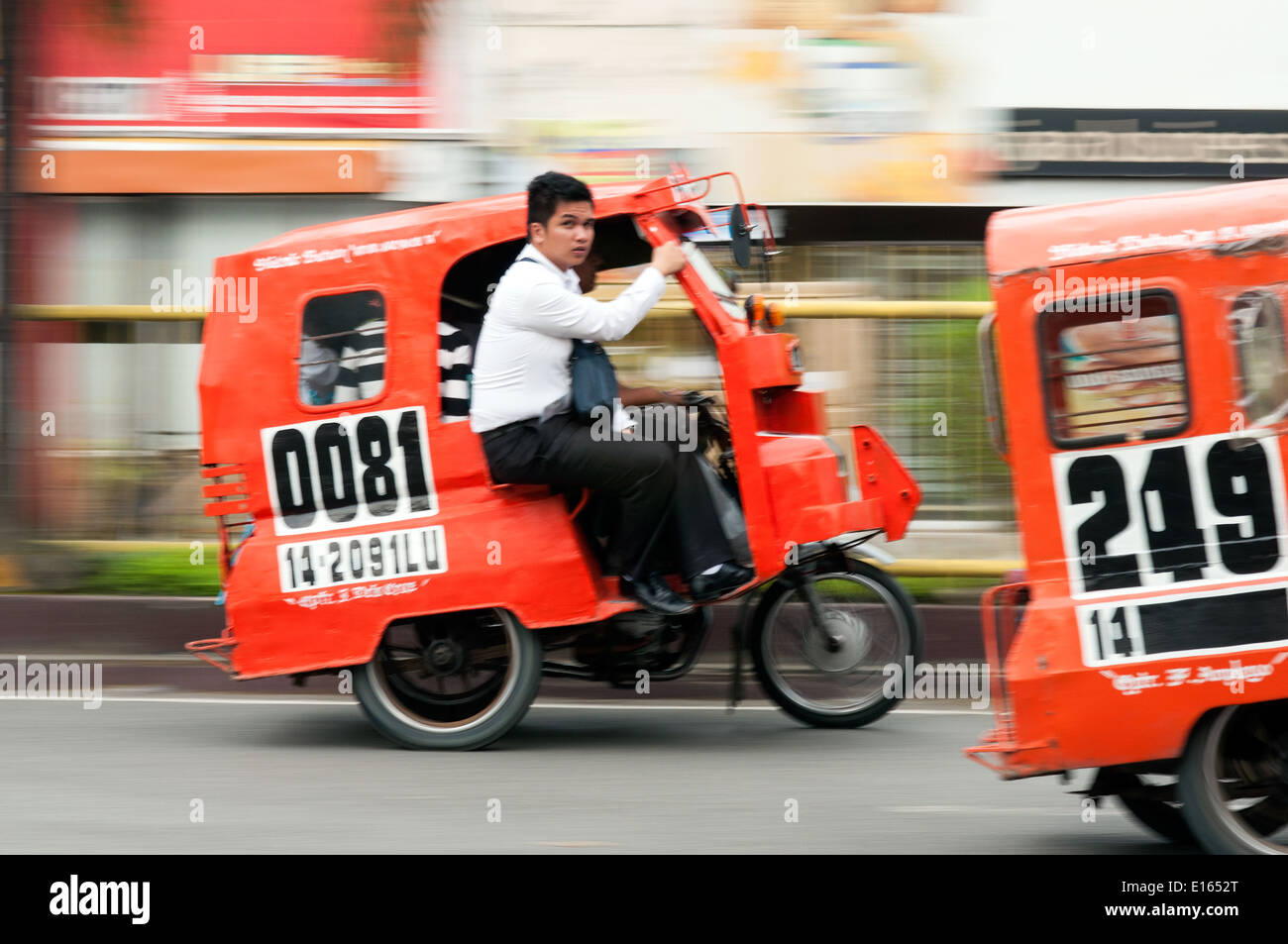 tricycle taxis in downtown Butuan, Mindanao, Philippines Stock Photo ...