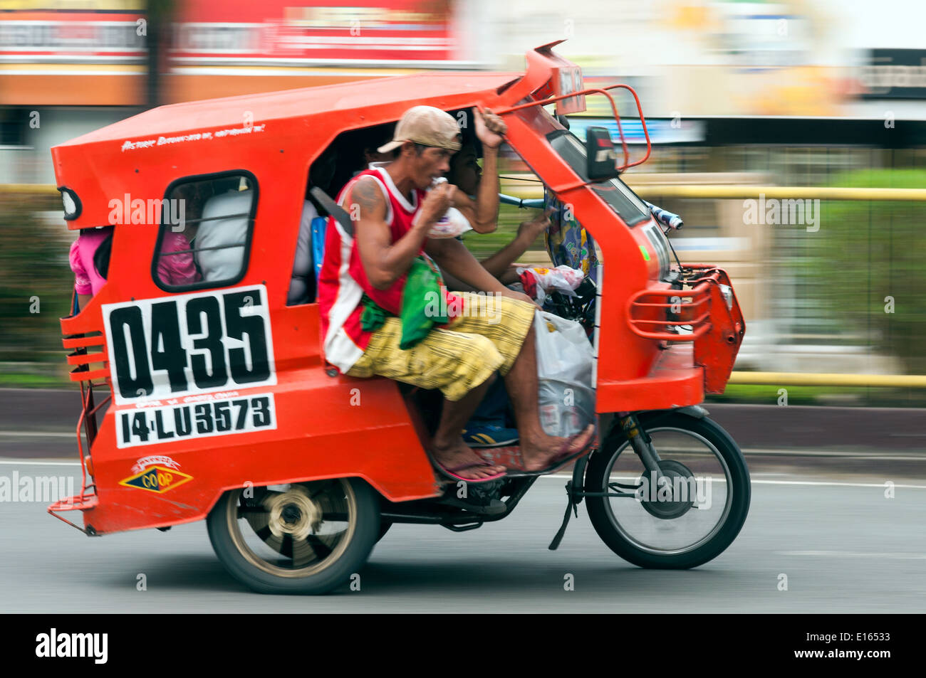 tricycle taxis in downtown Butuan, Mindanao, Philippines Stock Photo ...