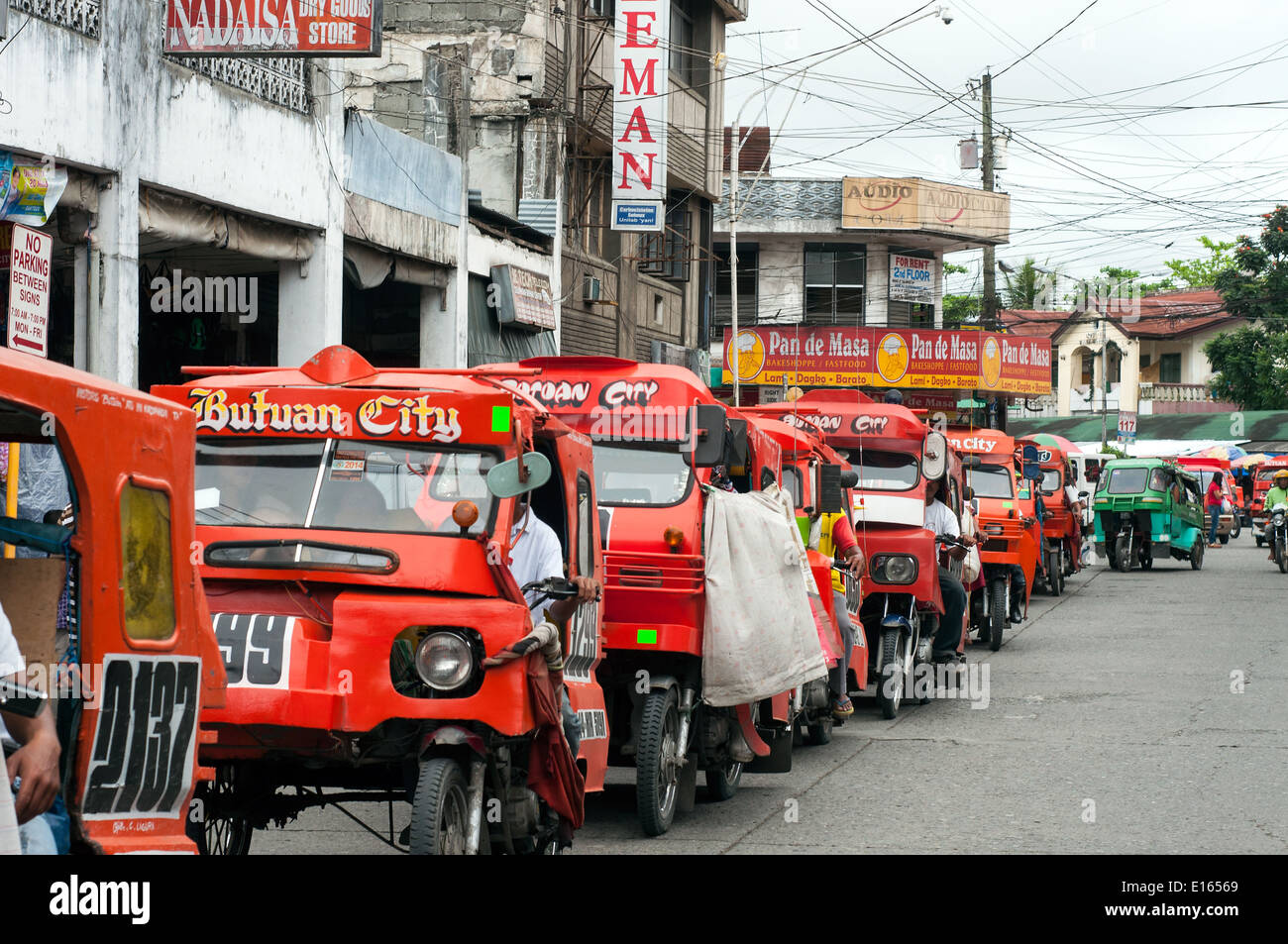 tricycle taxis in downtown Butuan, Mindanao, Philippines Stock Photo ...