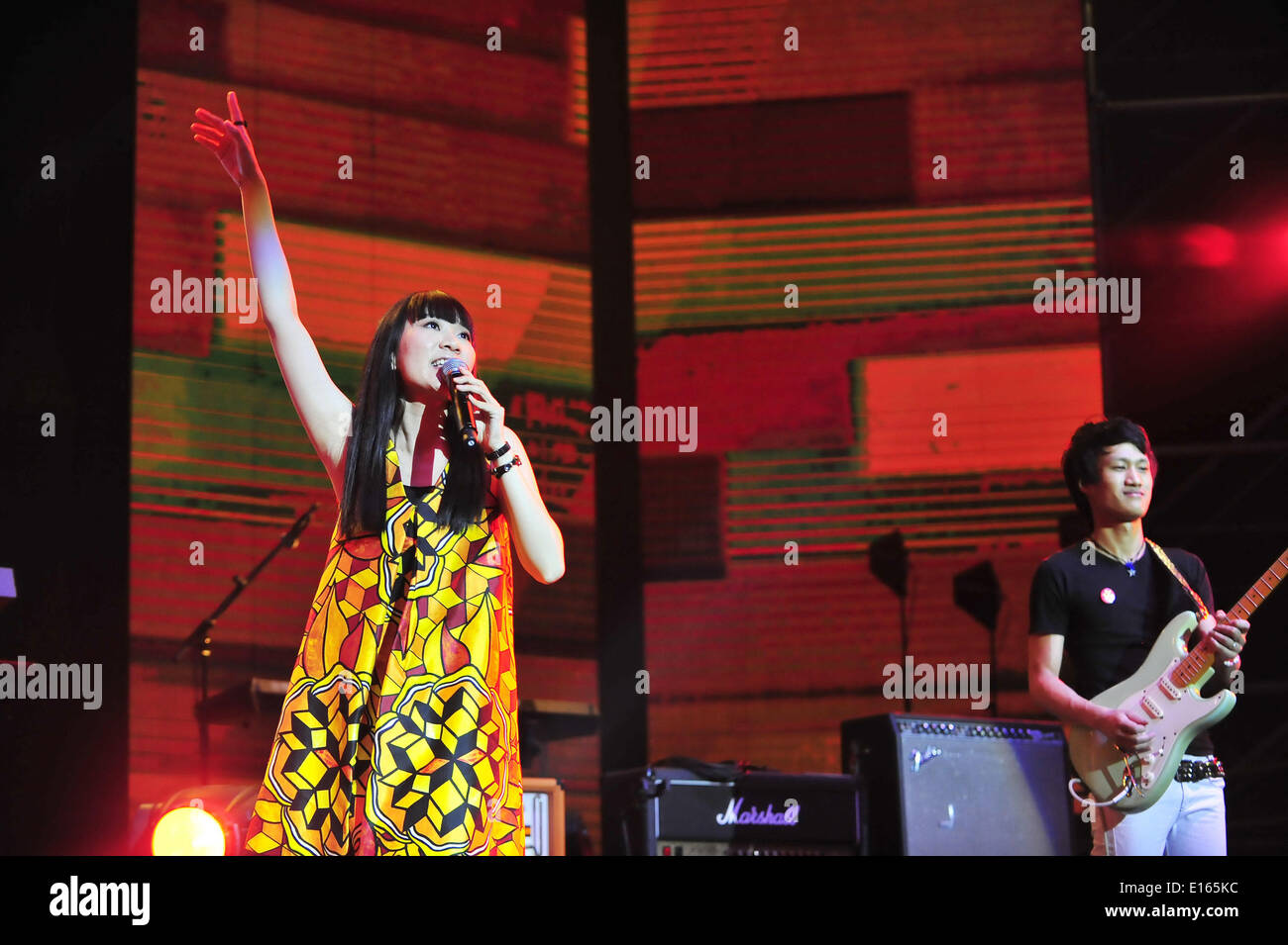 Beijing, China. 23rd May, 2014. Singer A Si (L) performs during "We Can ...