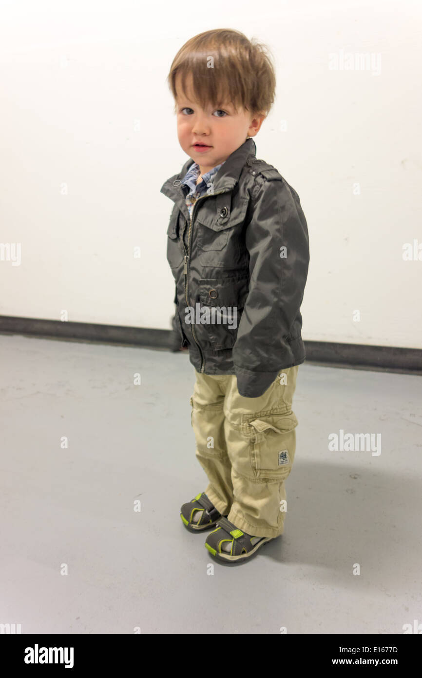 Portrait of a boy standing and smiling Stock Photo - Alamy