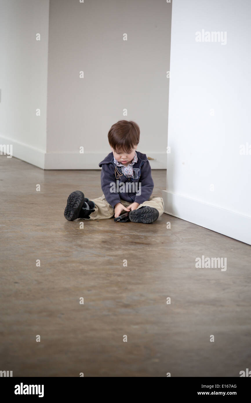Boy playing with a remote control Stock Photo - Alamy