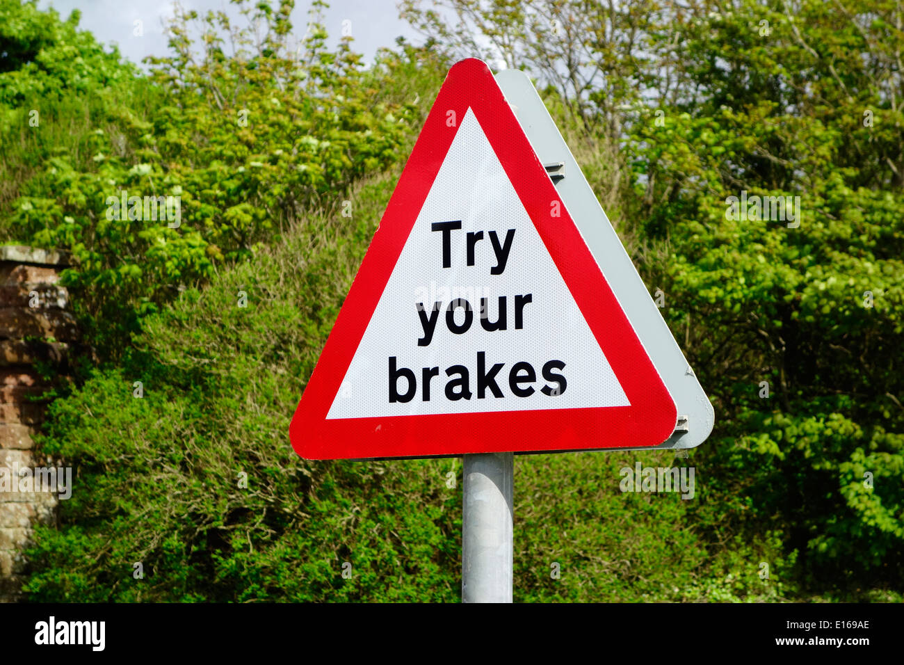 Red Warning Triangular Try Your Brakes Road Sign, UK Stock Photo - Alamy