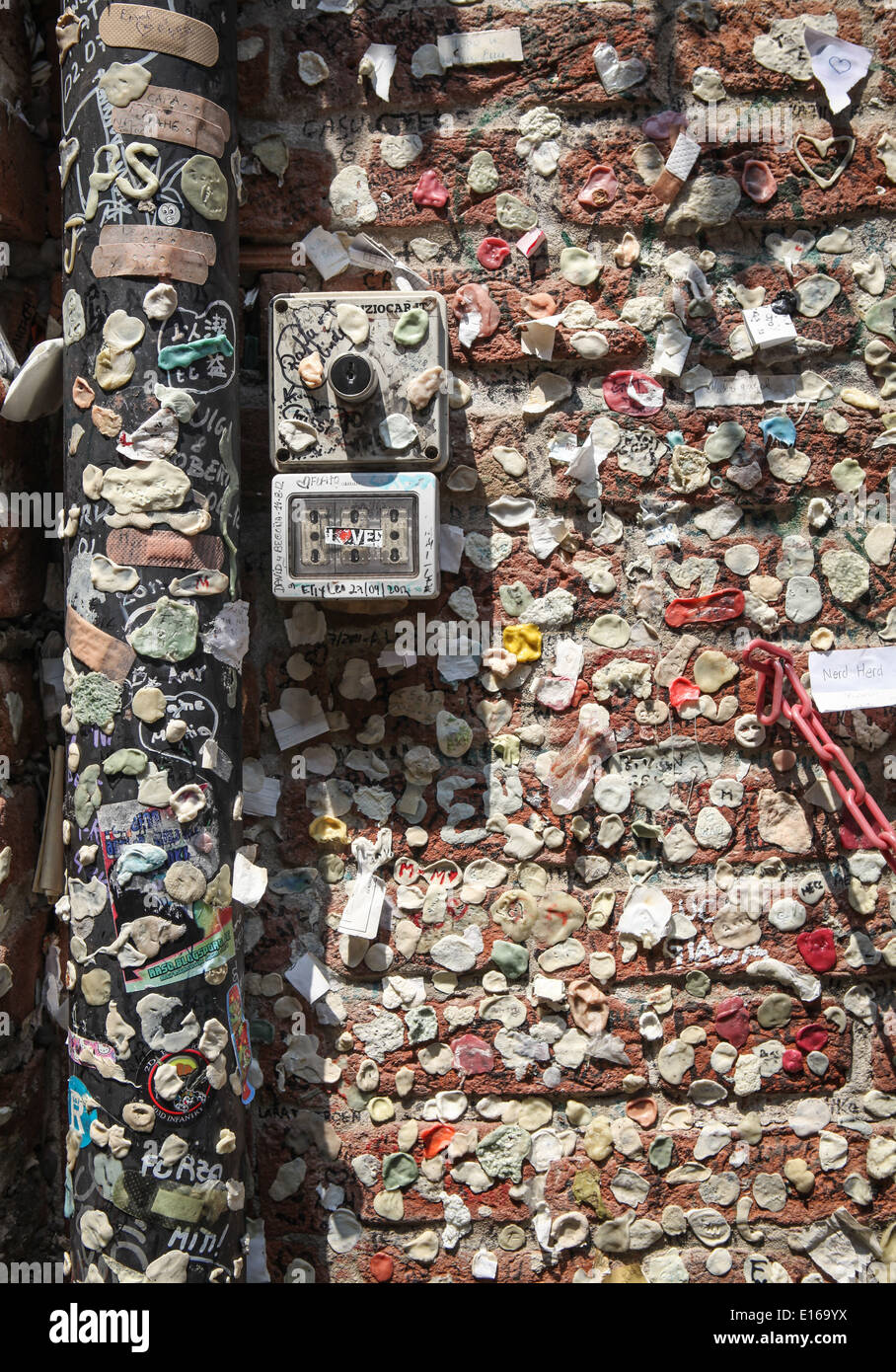 Colorful bubble gums stuck to the ancient brick wall and adjoining ...