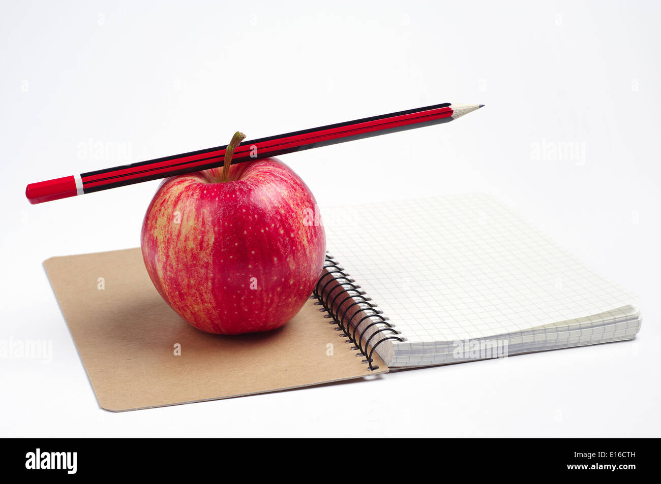 Notebook, pencil and apple on white background Stock Photo - Alamy