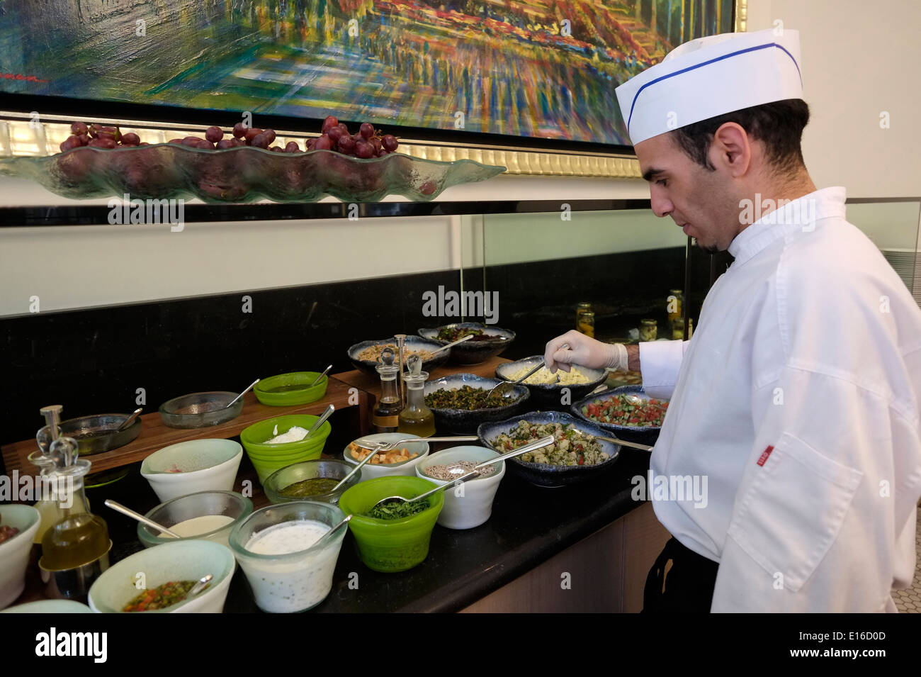 A cooker organizing breakfast buffet in Waldorf Astoria Jerusalem Hotel ...