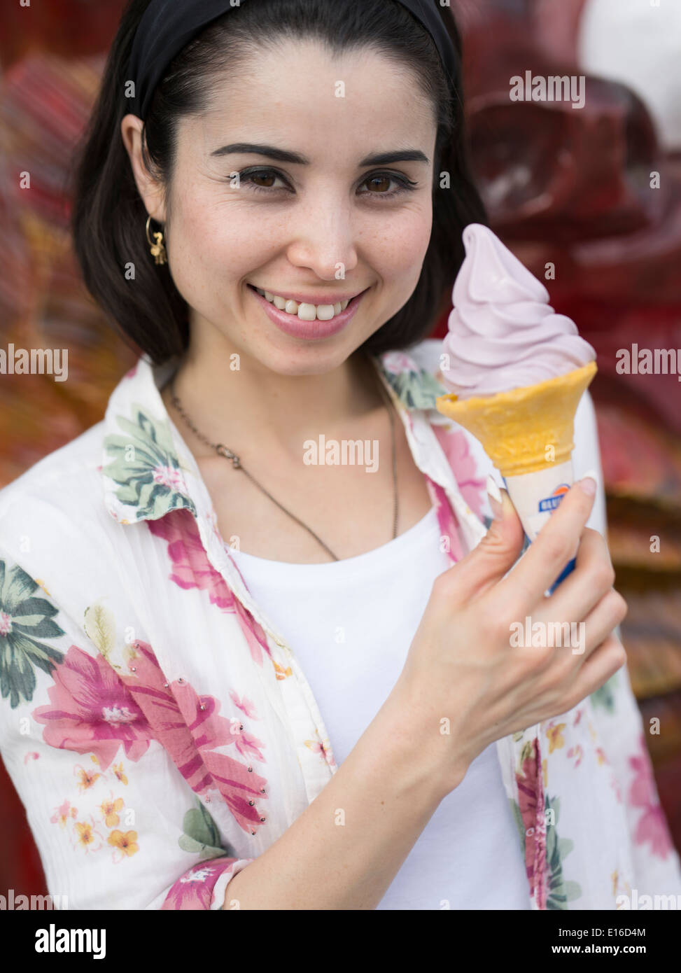 Woman (model released) eating Purple Potato Ice cream by Blue Seal on ...