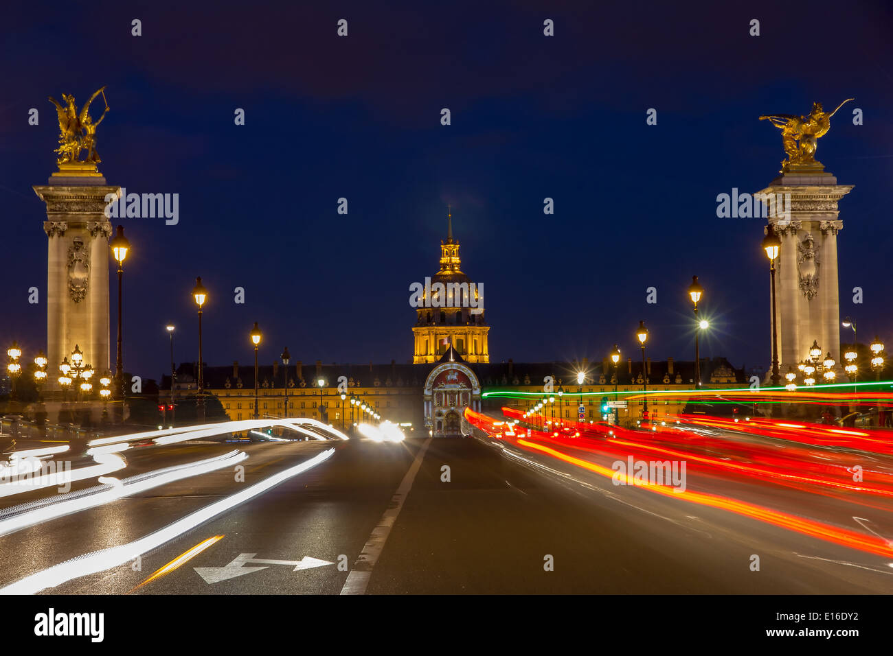 Pont Alexandre III and Les Invalides at night illumination in Paris ...