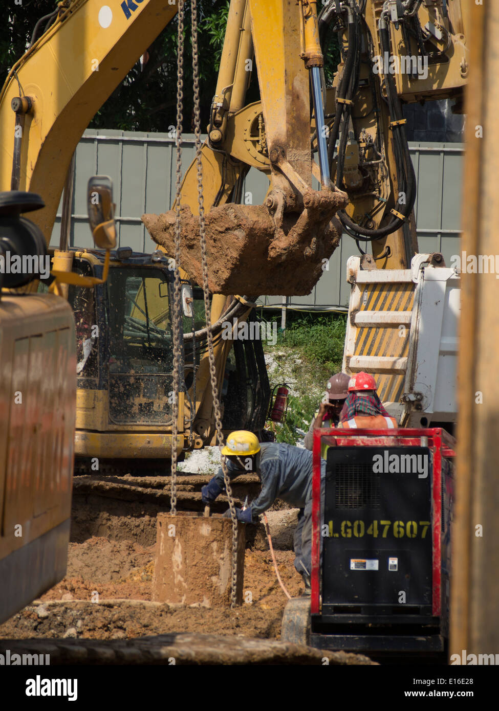 Foreign migrant workers at a construction site in Singapore Stock Photo ...