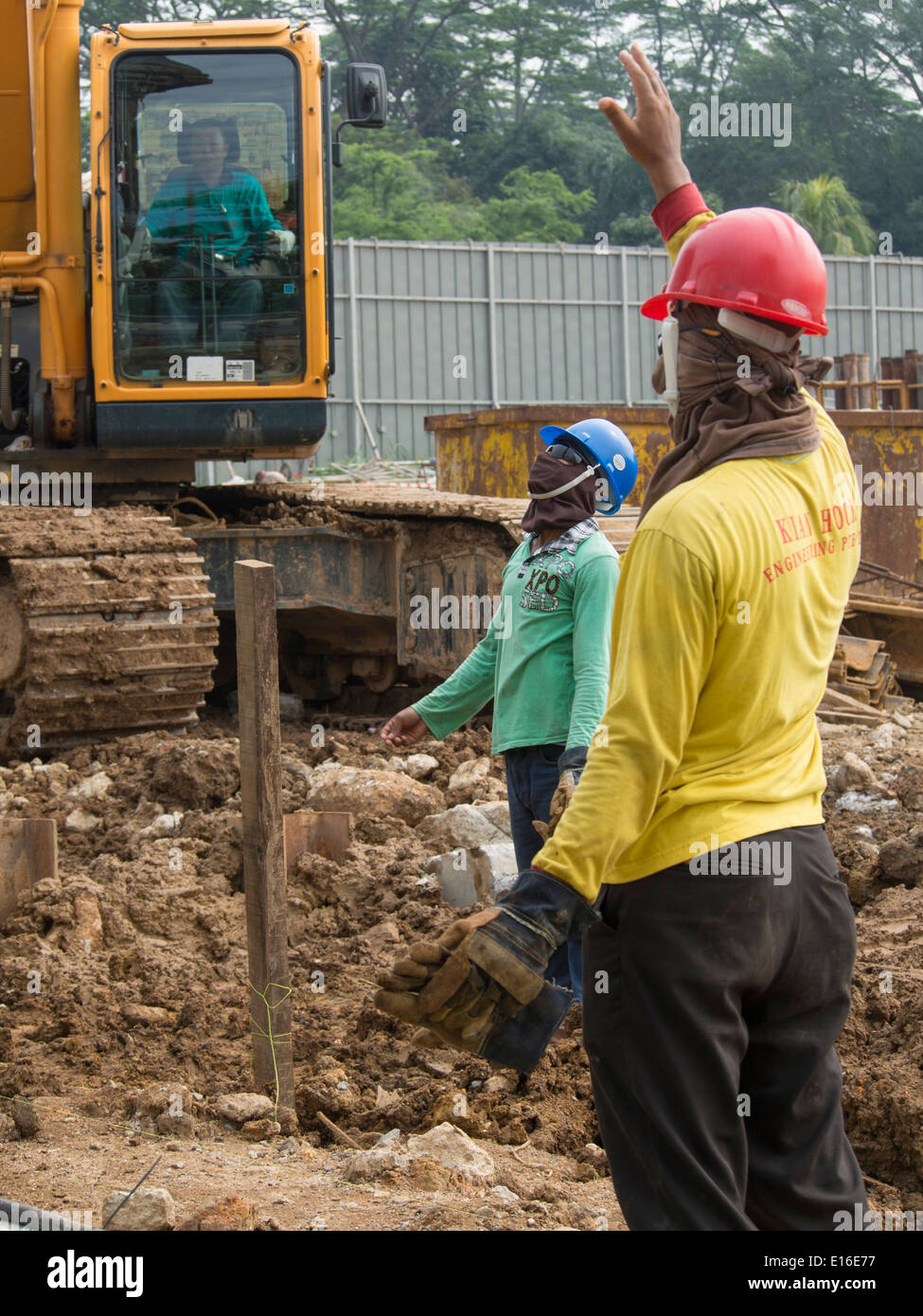 Foreign migrant workers at a construction site in Singapore Stock Photo ...