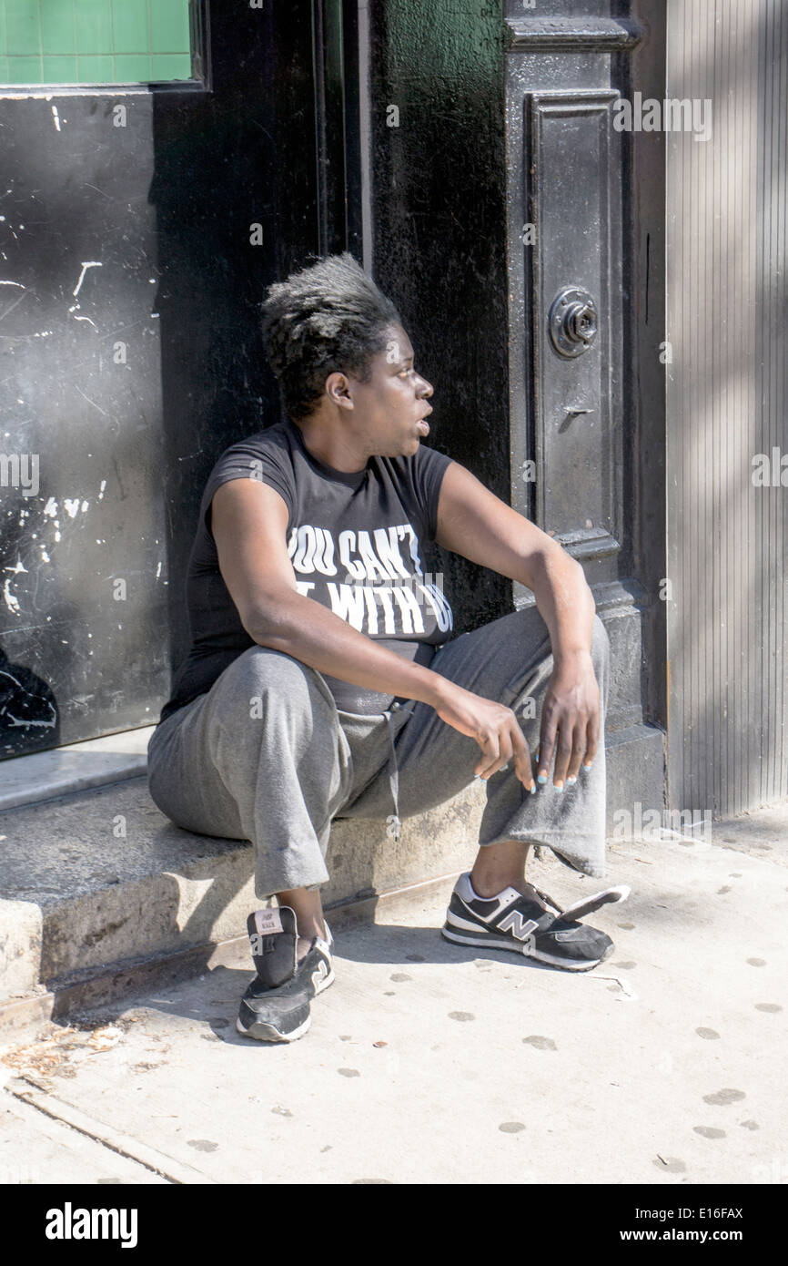 Sitting on stoop hi-res stock photography and images - Alamy