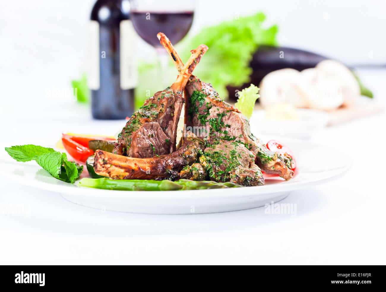 Stewed mutton with grilled vegetables on a white plate Stock Photo - Alamy