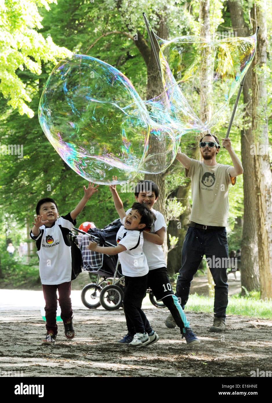 Munich, Germany. 24th May, 2014. Children walk underneath a giant ...