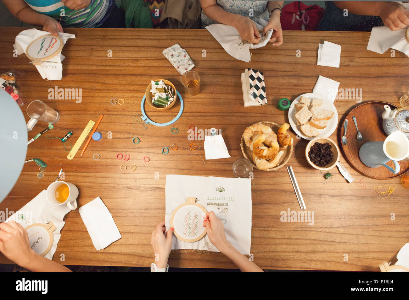 Women cross stitching during gathering Stock Photo - Alamy