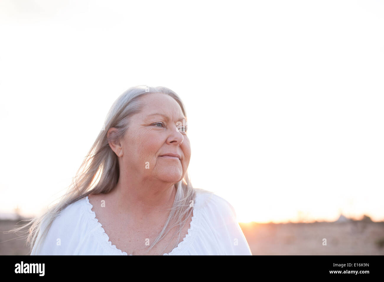 Portrait of content middle aged woman Stock Photo - Alamy