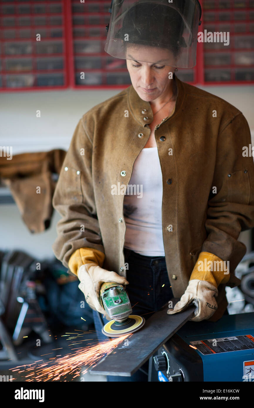 Female welder at work in her garage Stock Photo - Alamy