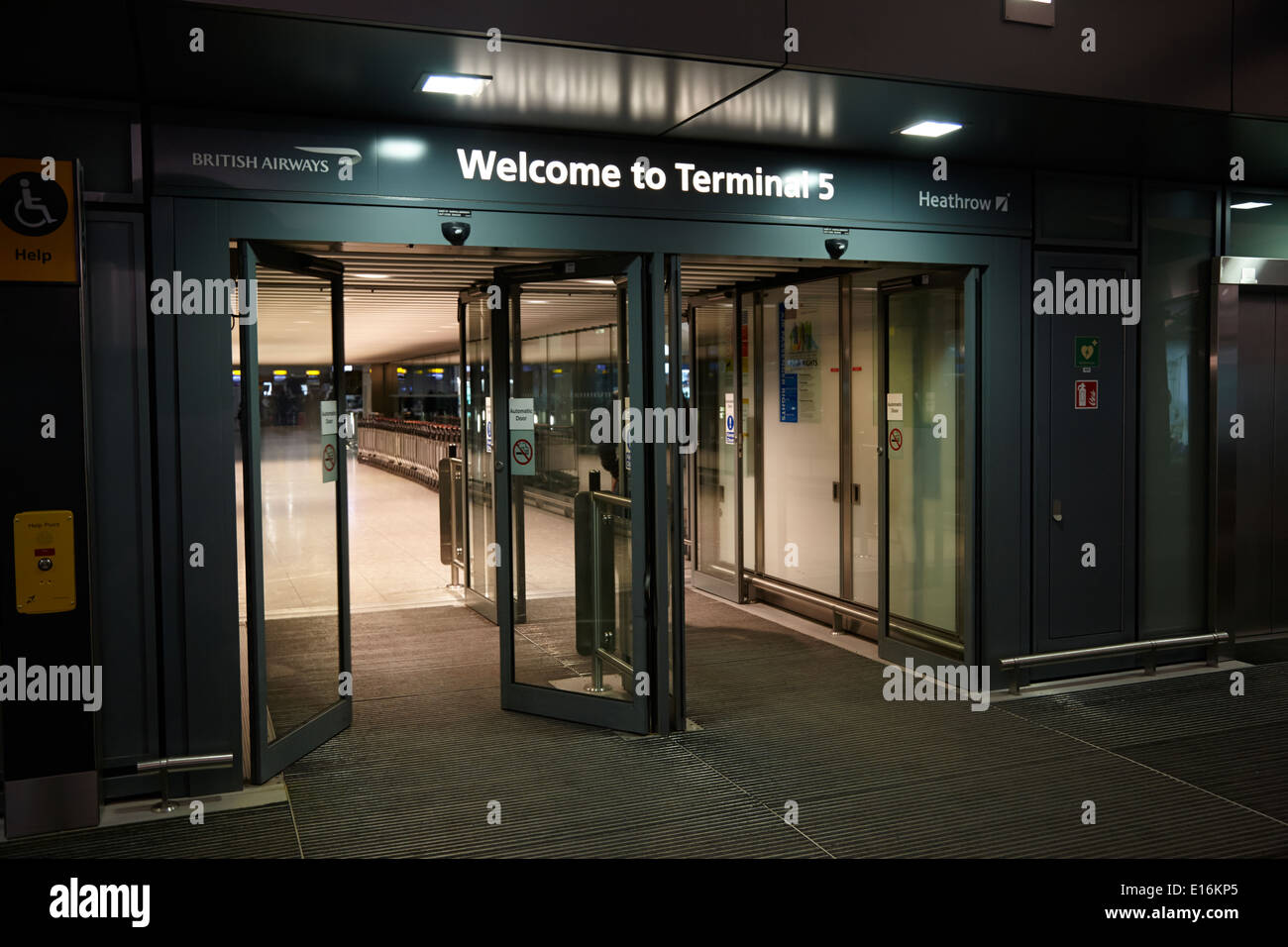 man entering London Heathrow Airport Terminal 5 early in the morning UK ...