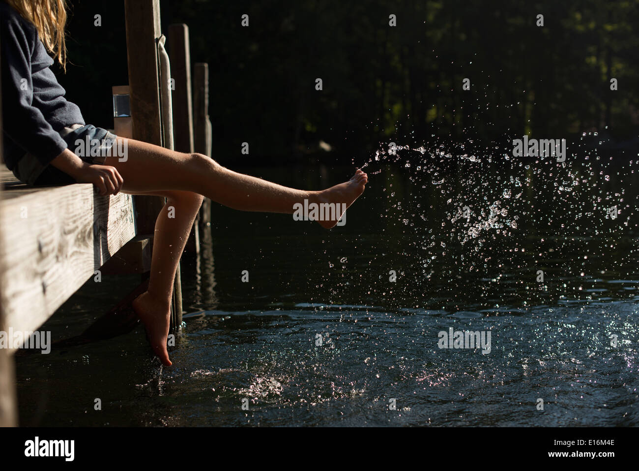Girl (8-9) splashing water Stock Photo - Alamy