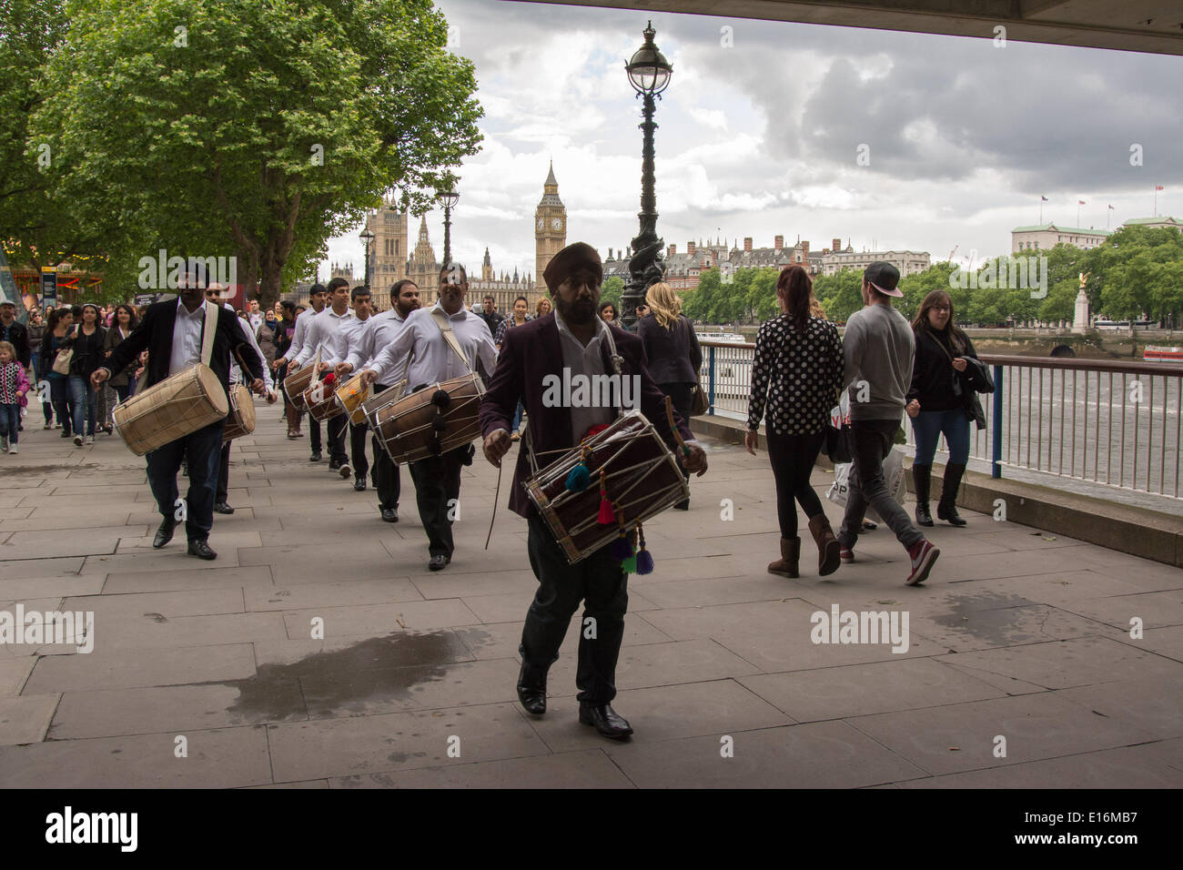A band of Dhol drummers entertain the crowds outside the Queen ...