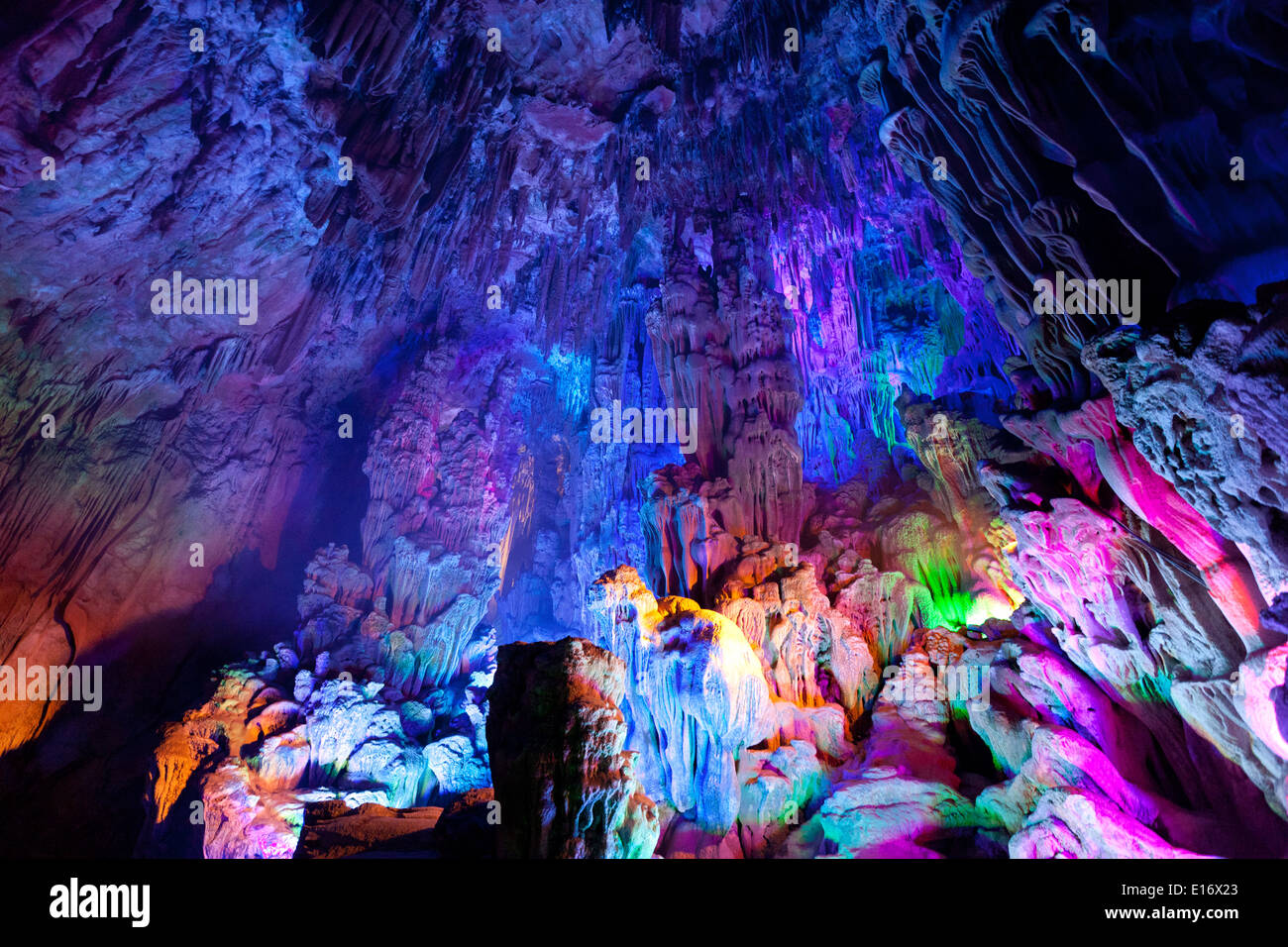 China Guilin.Colorfully lit stalactites and stalagmites inside the Ludi ...