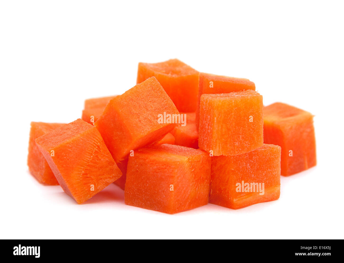 Carrot vegetable cube heap isolated on white background Stock Photo - Alamy