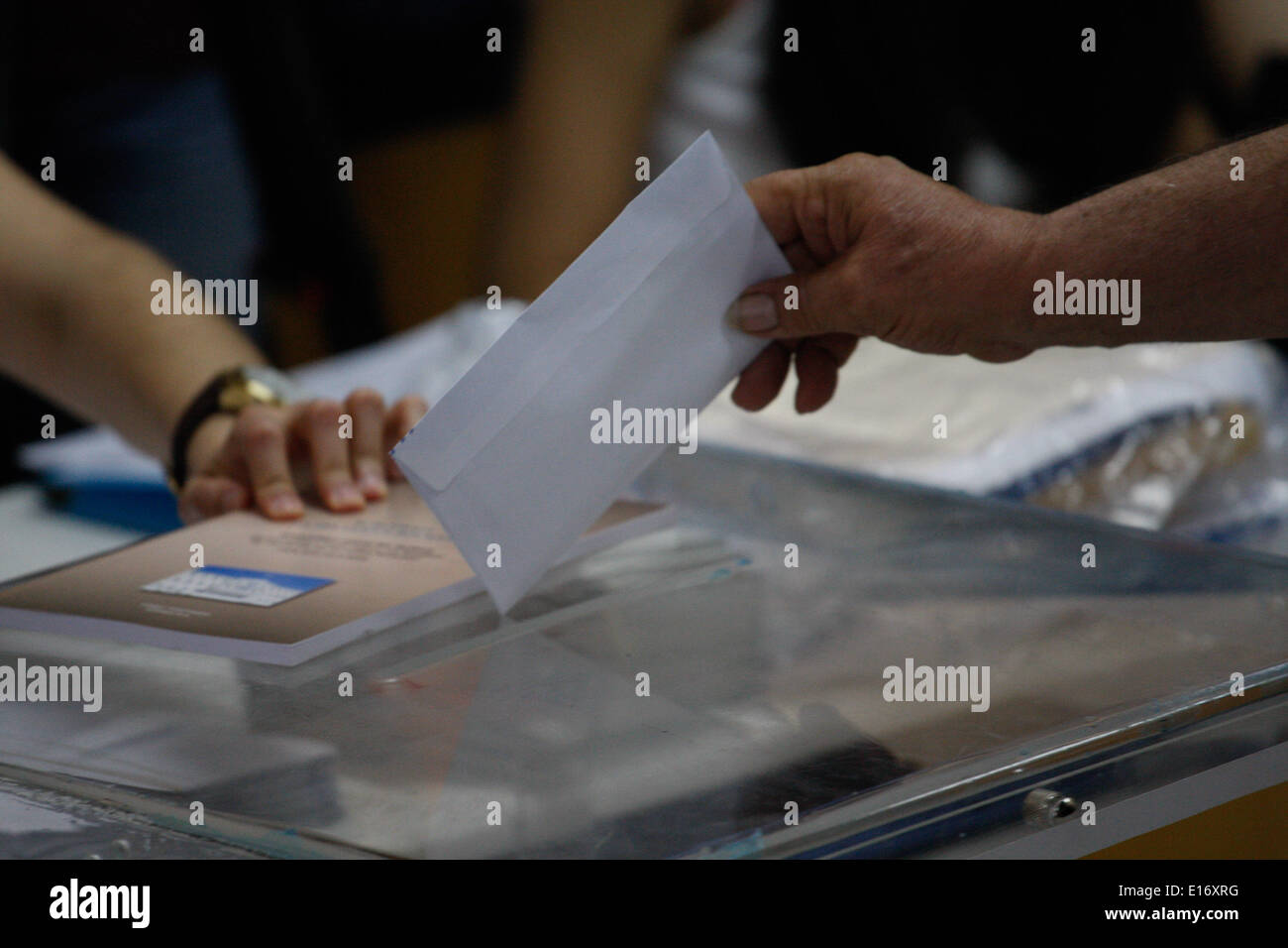 Athens, Greece. 25th May, 2014. An elderly woman casts his vote at a ...