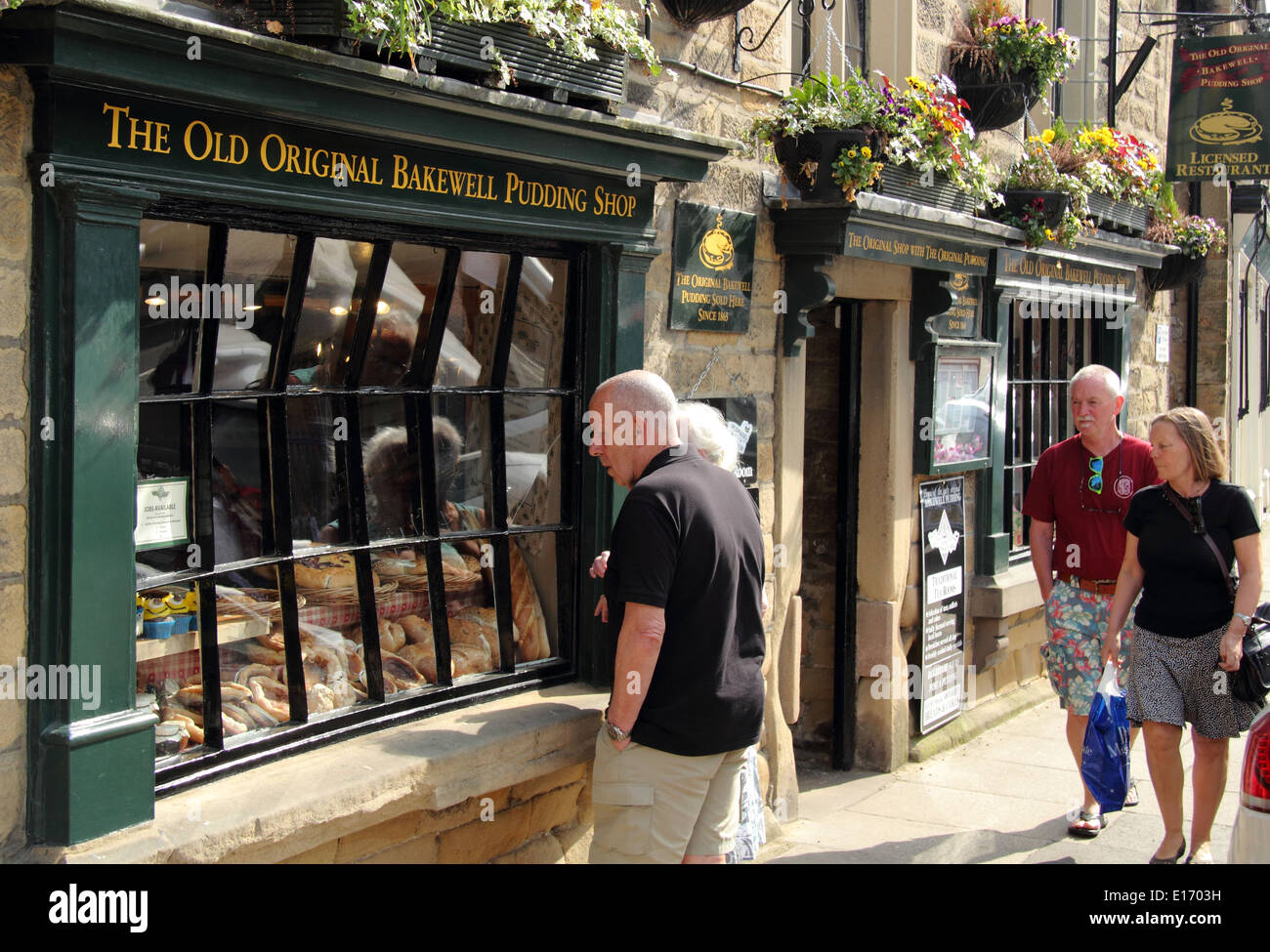 Tourists pause to look in The Old Original Bakewell Pudding Shop in ...