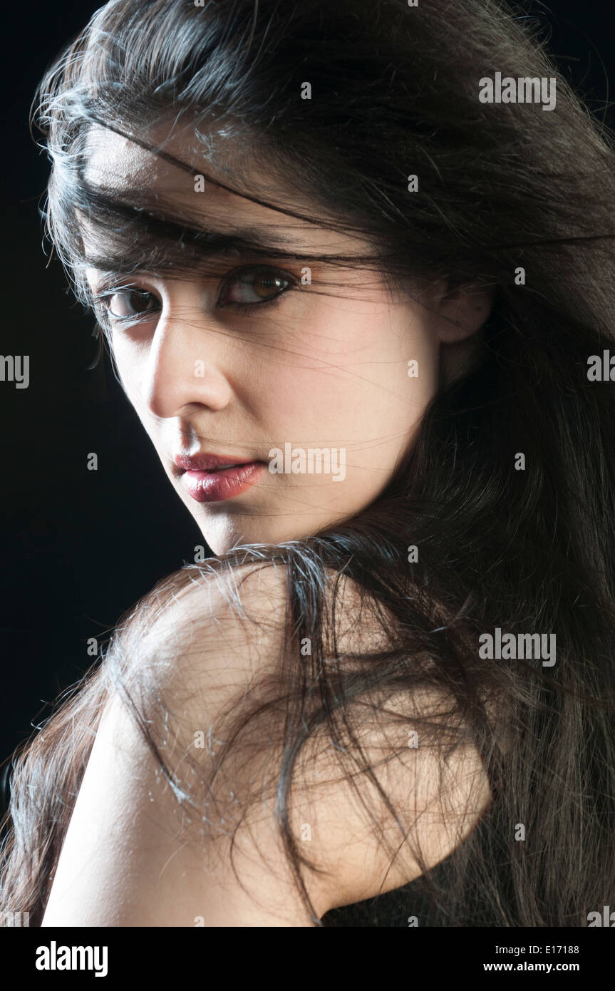 Beautiful young woman hair covering face Stock Photo - Alamy