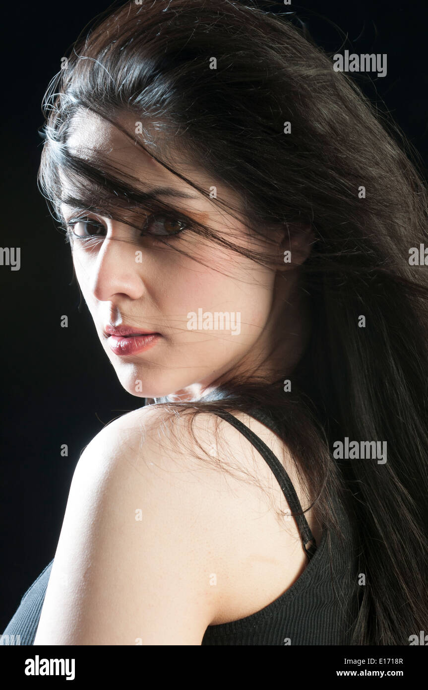 Beautiful young woman hair covering face Stock Photo - Alamy