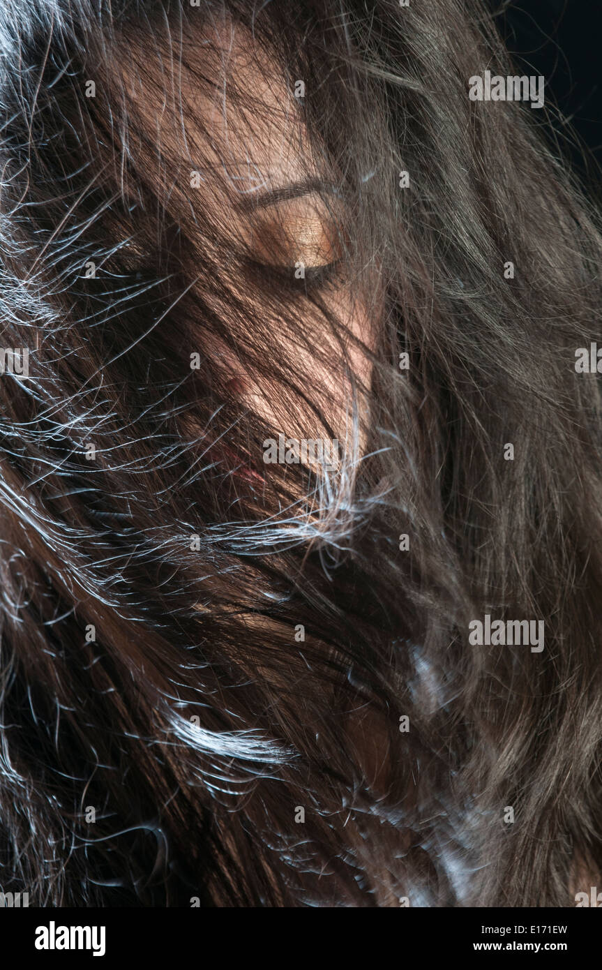 Beautiful young woman hair covering face Stock Photo - Alamy