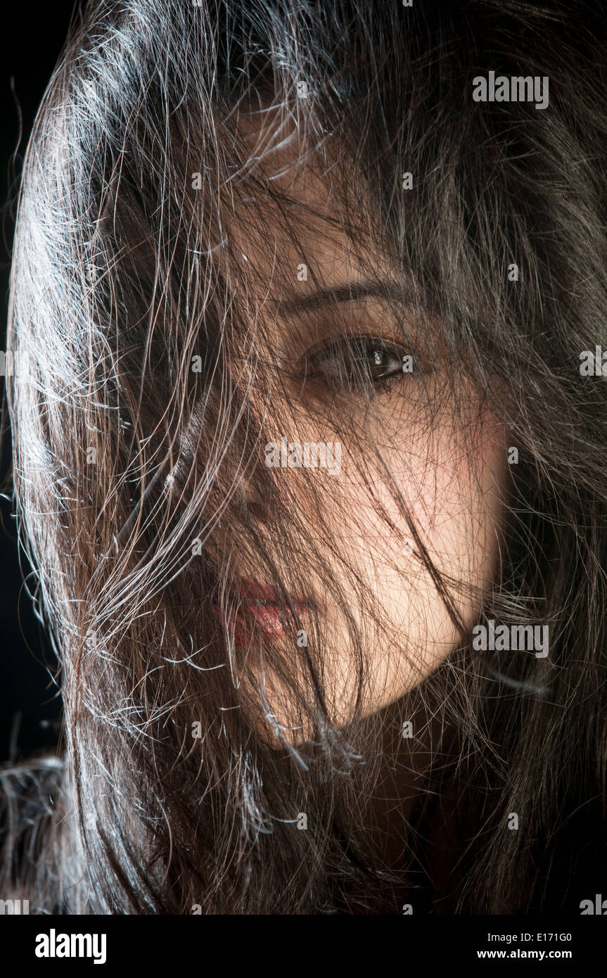 Beautiful young woman hair covering face Stock Photo - Alamy