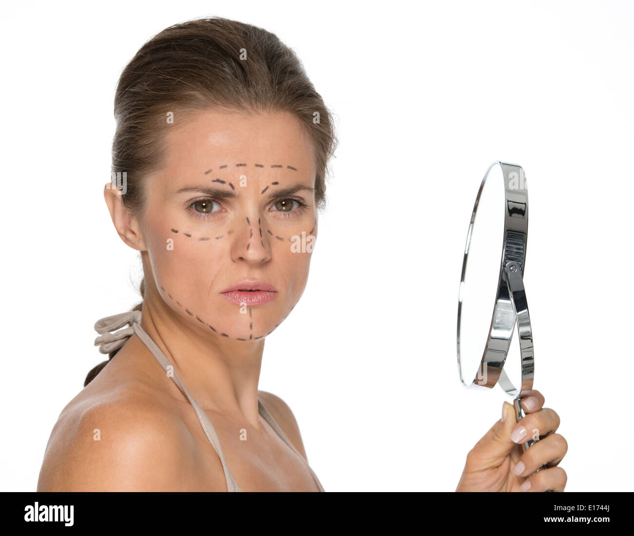 Beautiful young woman correcting hi-res stock photography and images ...