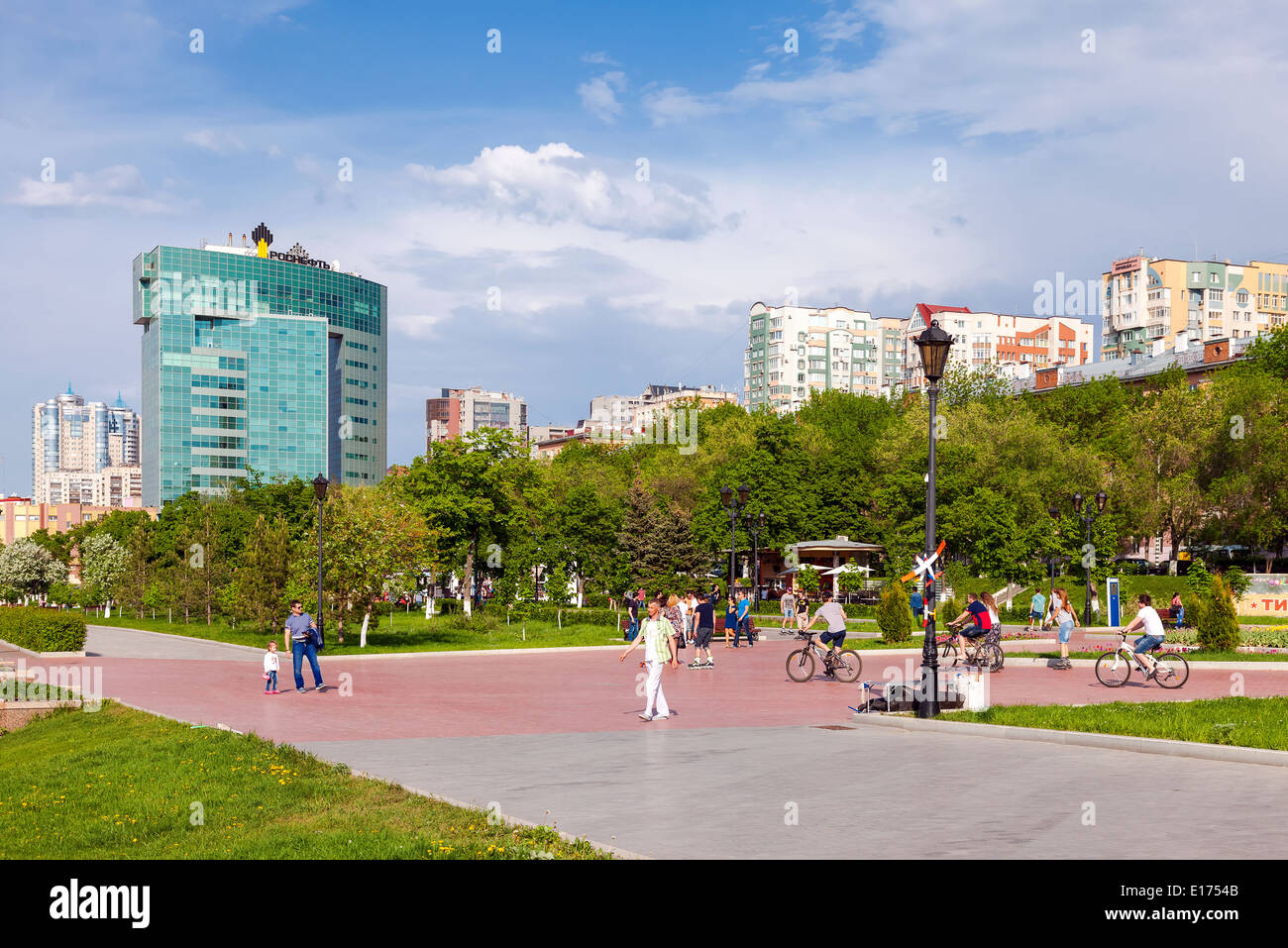 People walking along the waterfront in Samara on a sunny day. Samara is ...