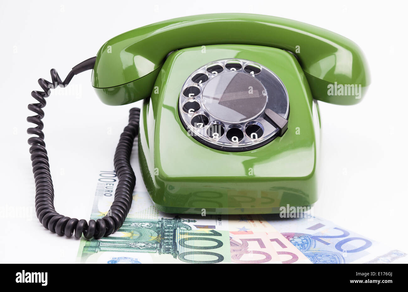 Image shows a green retro telephone isolated on a white background ...