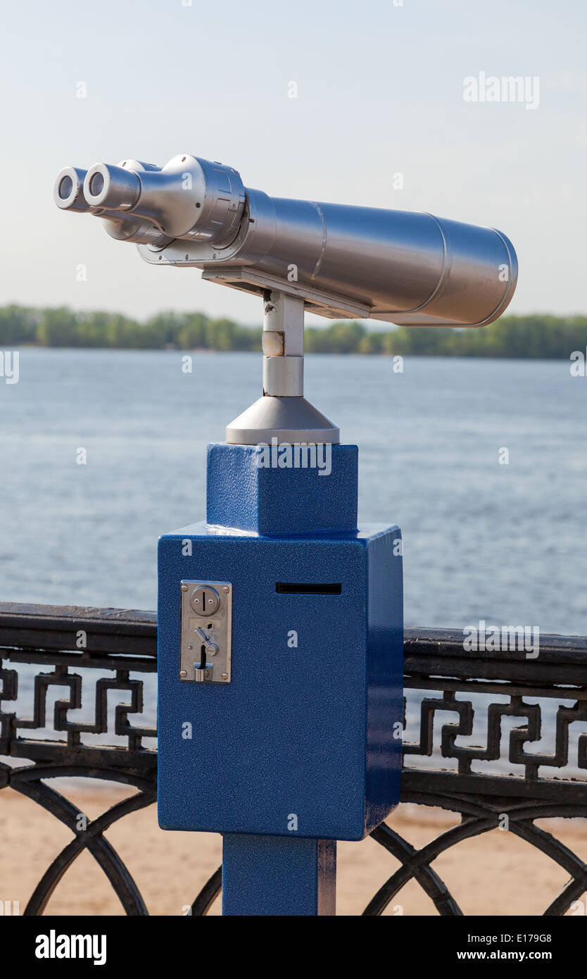 Coin operated binocular on the bank of river Stock Photo - Alamy