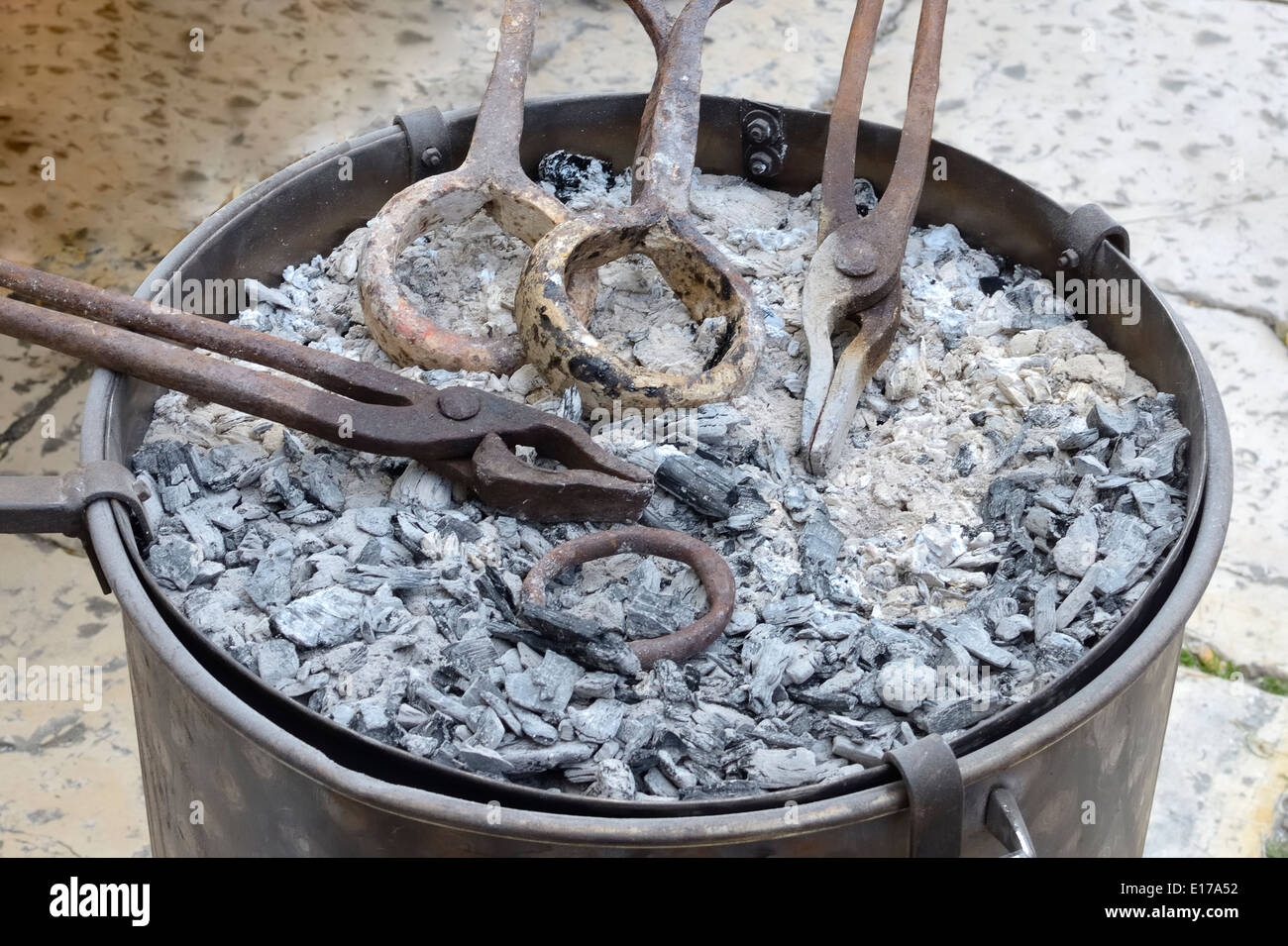brazier, pliers and tools of a medieval blacksmith Stock Photo ...