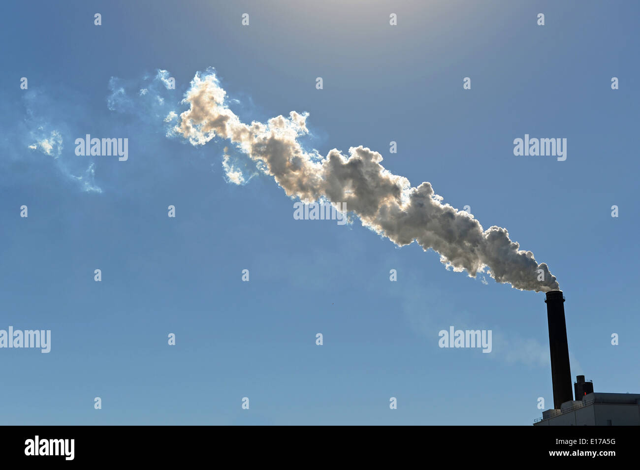 Industrial smokestack billowing smoke into atmosphere Stock Photo - Alamy